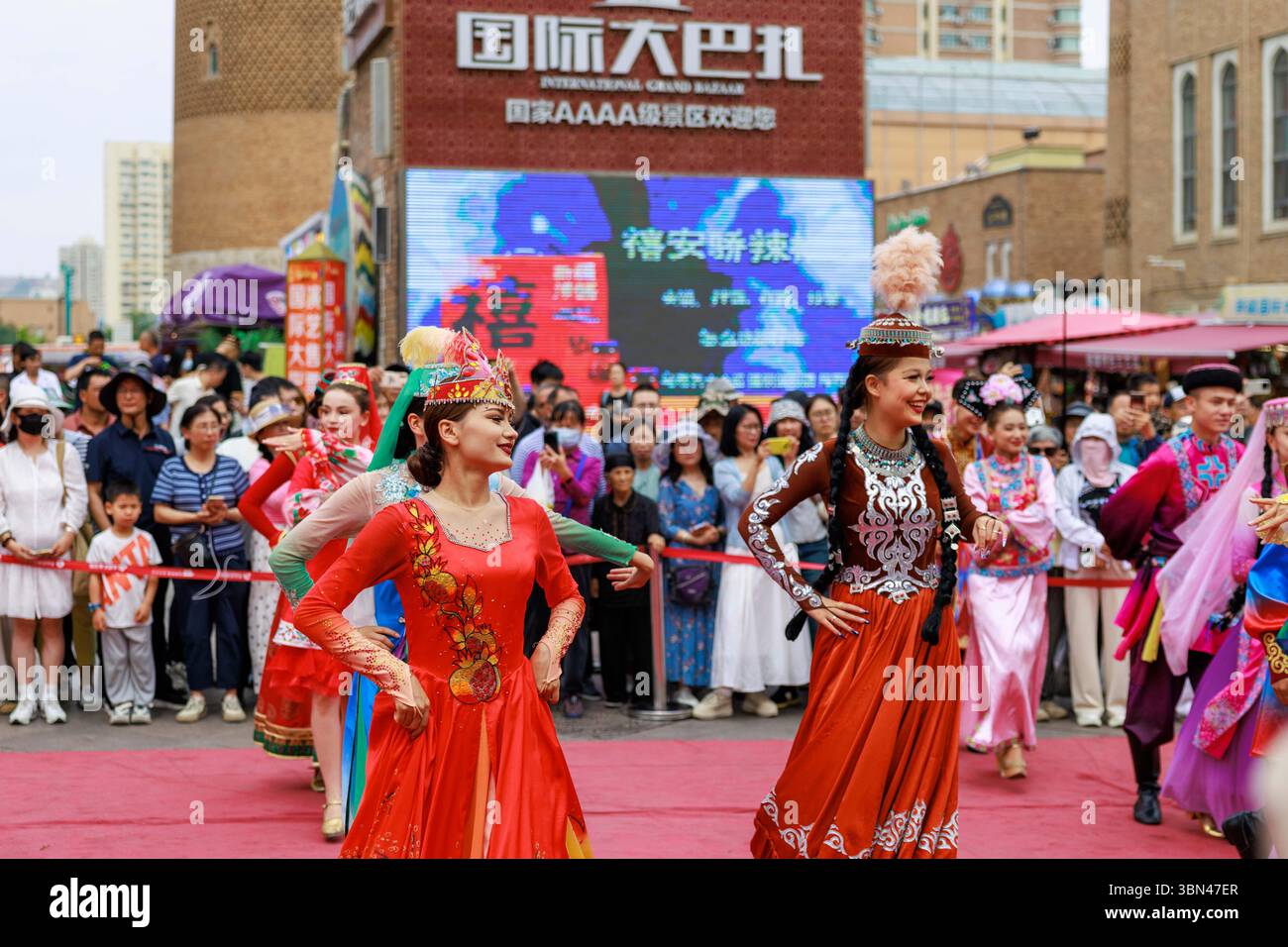 Tourists visit the Grand Bazaar in Urumqi City, northwest China's ...