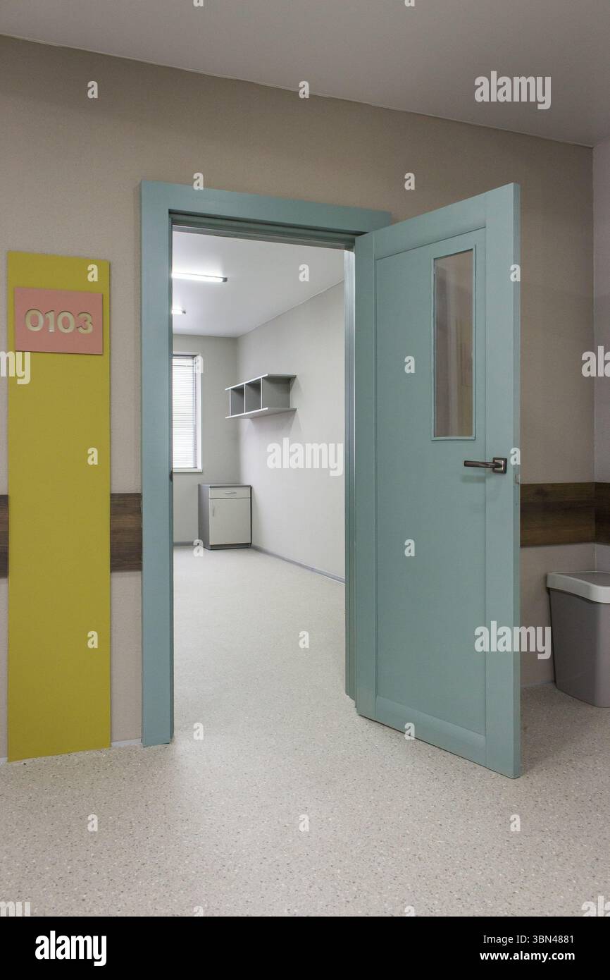 Open door to the patient room. Hospital interior. New clinic design ...