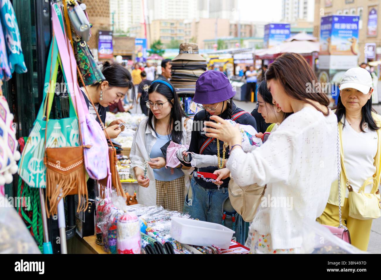 Tourists visit the Grand Bazaar in Urumqi City, northwest China's ...