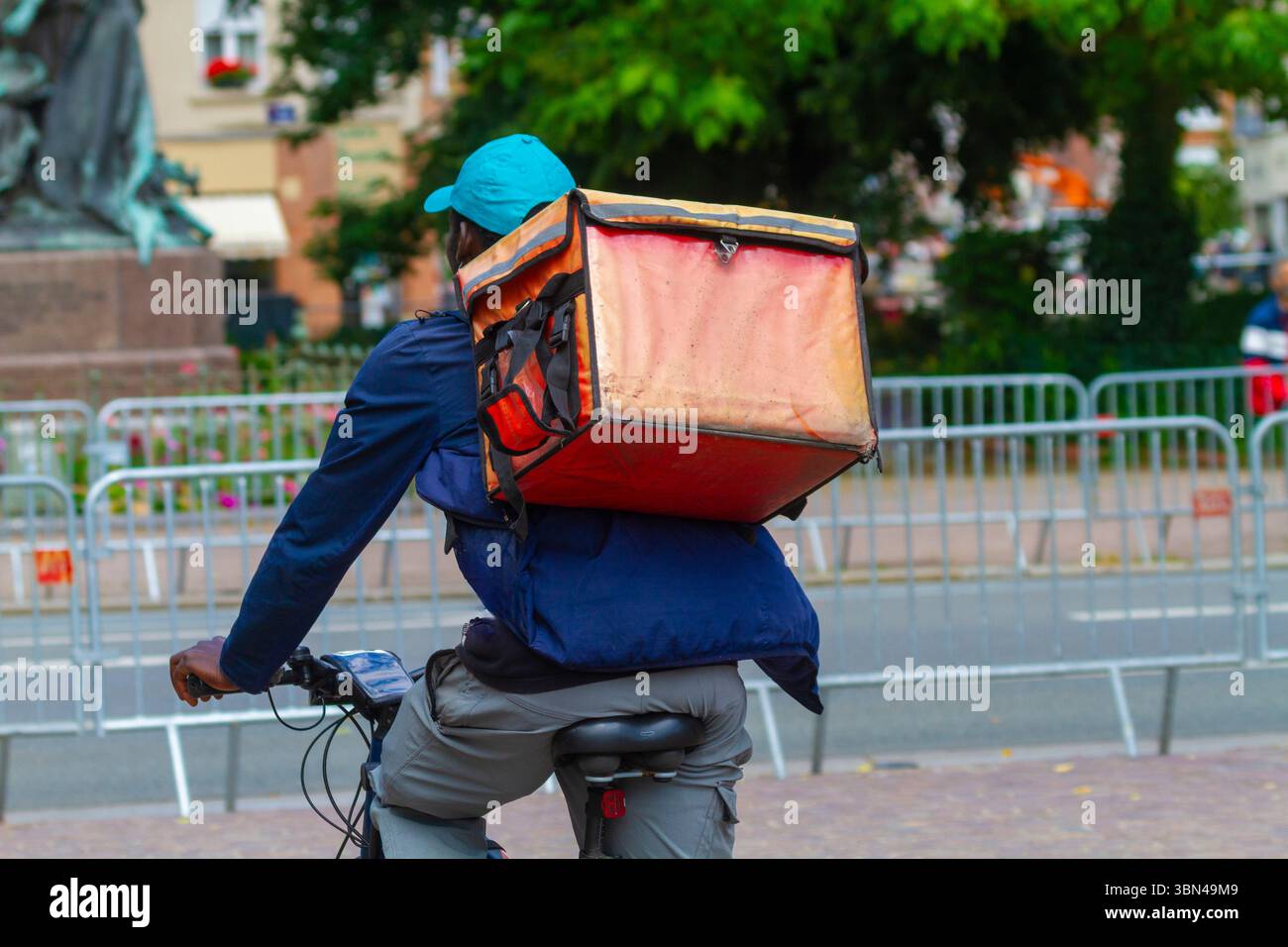 Bicycle delivery driver with an icebox in very poor condition Stock ...