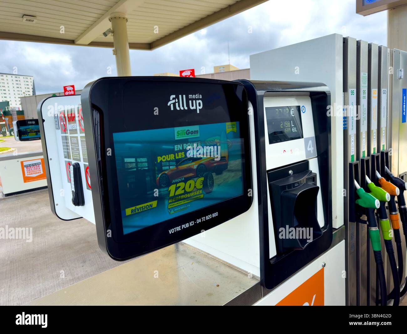 Advertising on a gas station screen Stock Photo - Alamy