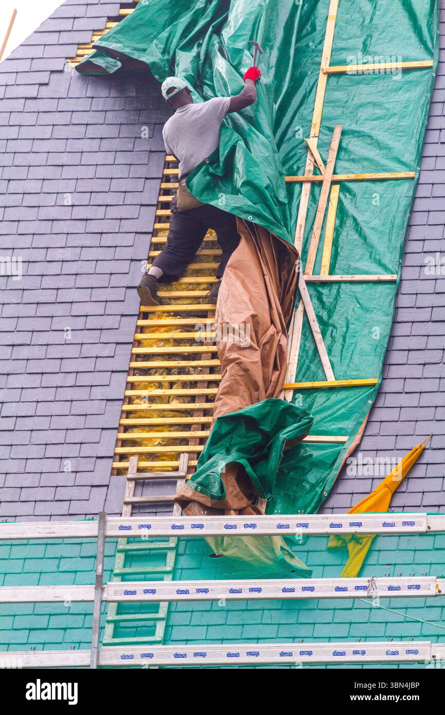 Man works on installing hi-res stock photography and images - Alamy