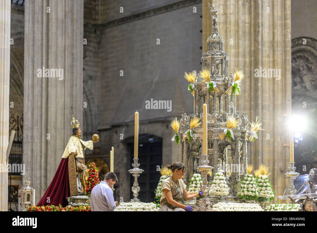 Seville, Spain, June 18 2025, Workers adorn the monumental silver ...