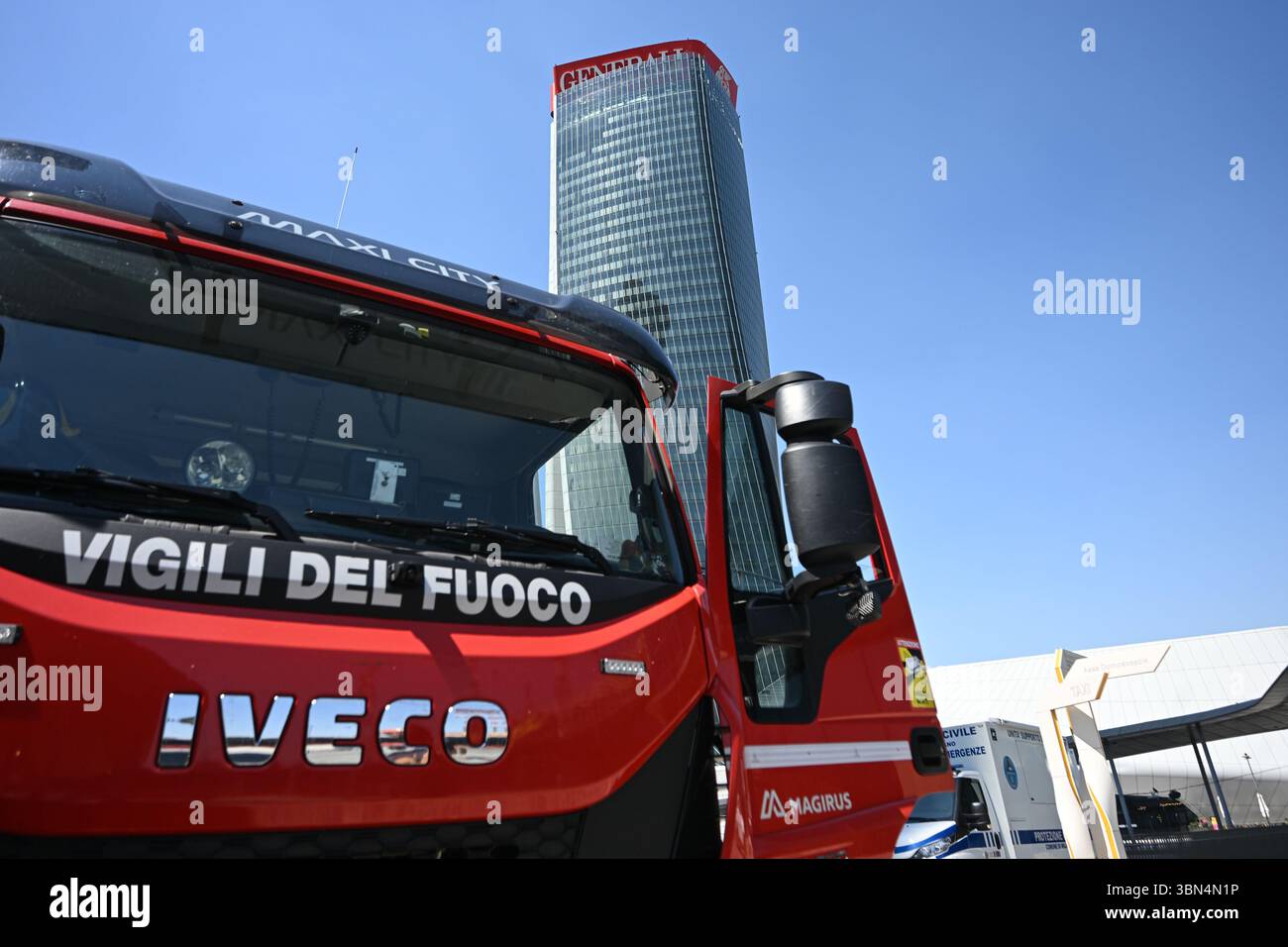 Milan, Italy - 30 June 2025: Firefighters vehicles are seen under thee ...