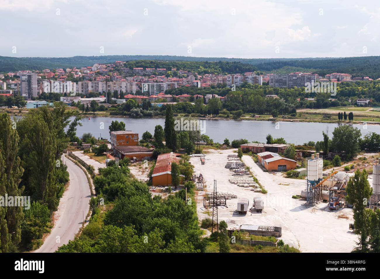 A scenic aerial view capturing a suburban neighborhood, adjacent river ...