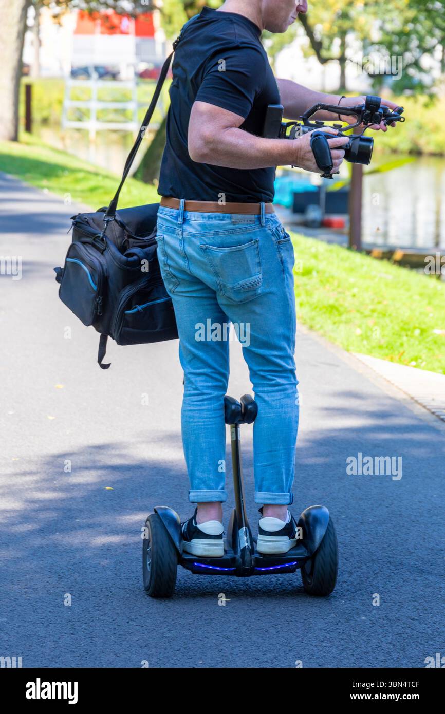 Man filming on an Overboard Stock Photo - Alamy