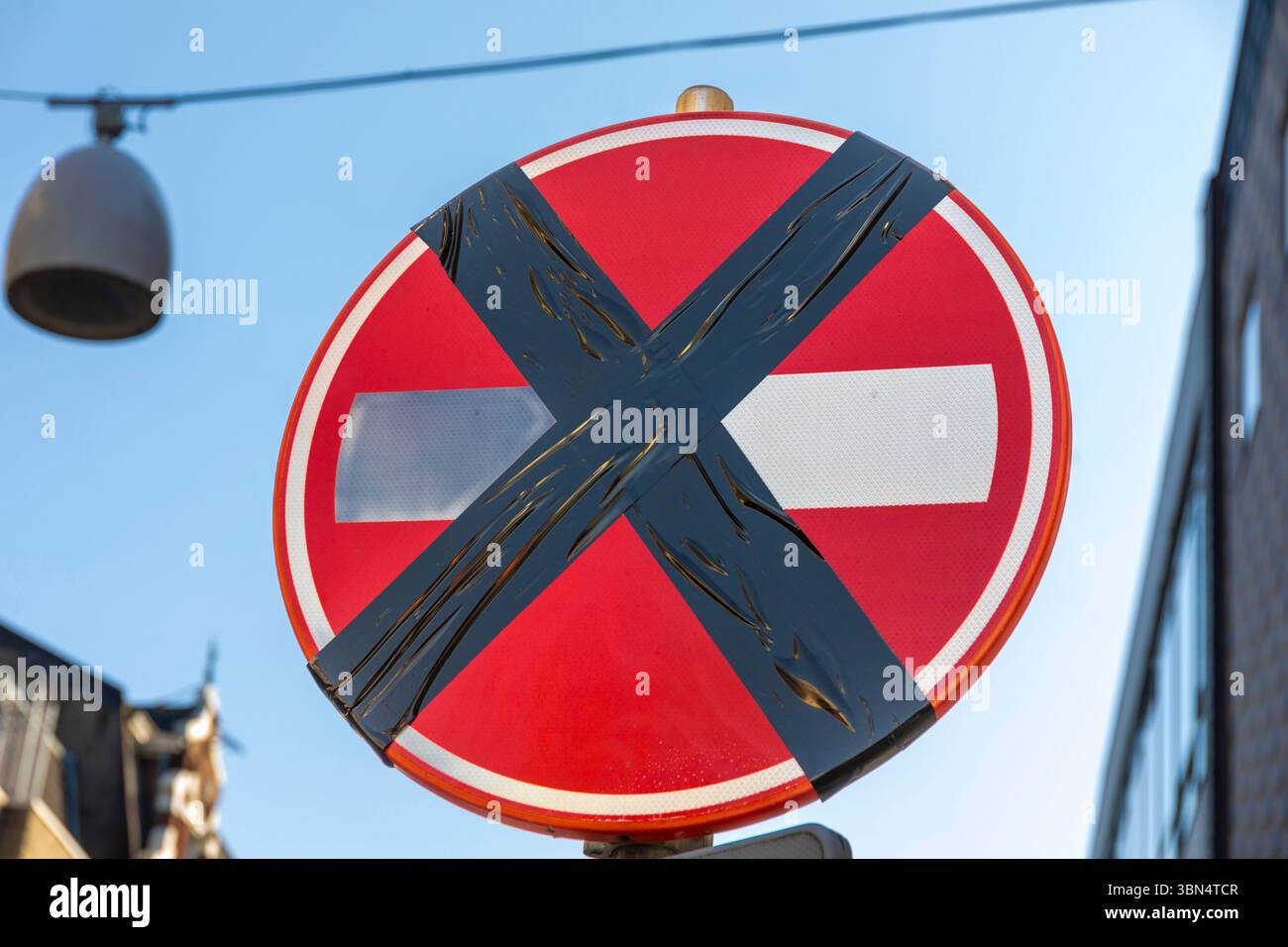 Direction sign, forbidden, crossed out with tape Stock Photo - Alamy