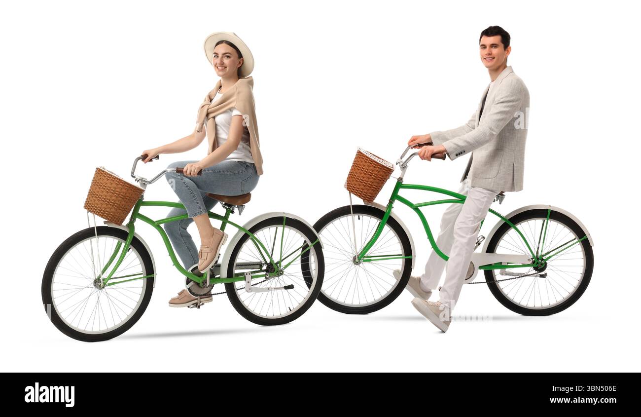 Handsome man and beautiful woman riding bicycles on white background ...
