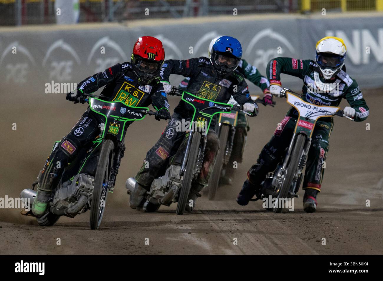 Rybnik, Poland. 30th June, 2025. Chris Holder of ROW (Red) leads Gleb ...
