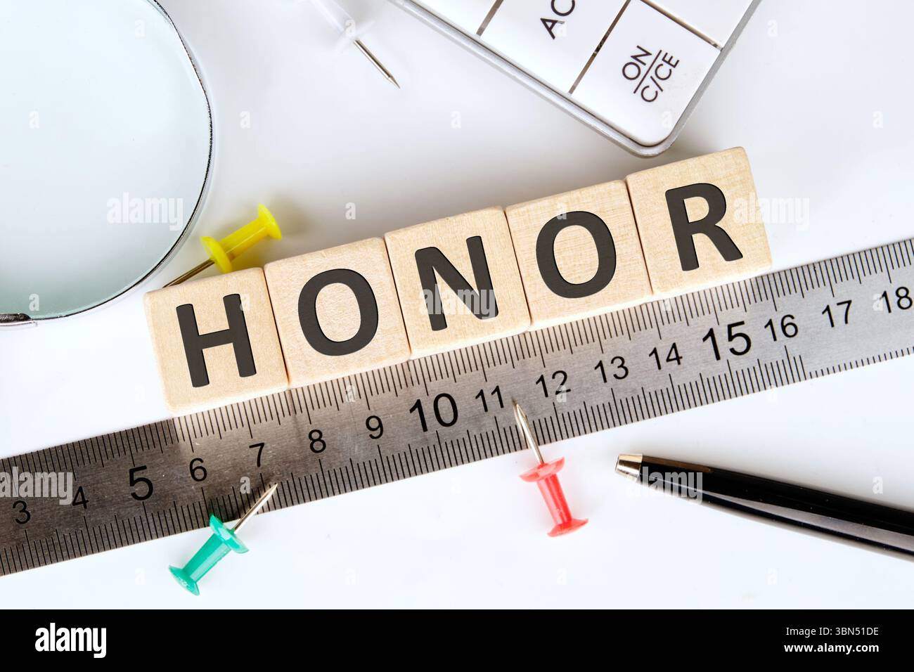 The HONOR concept word is assembled from wooden cubes. ethics, respect ...