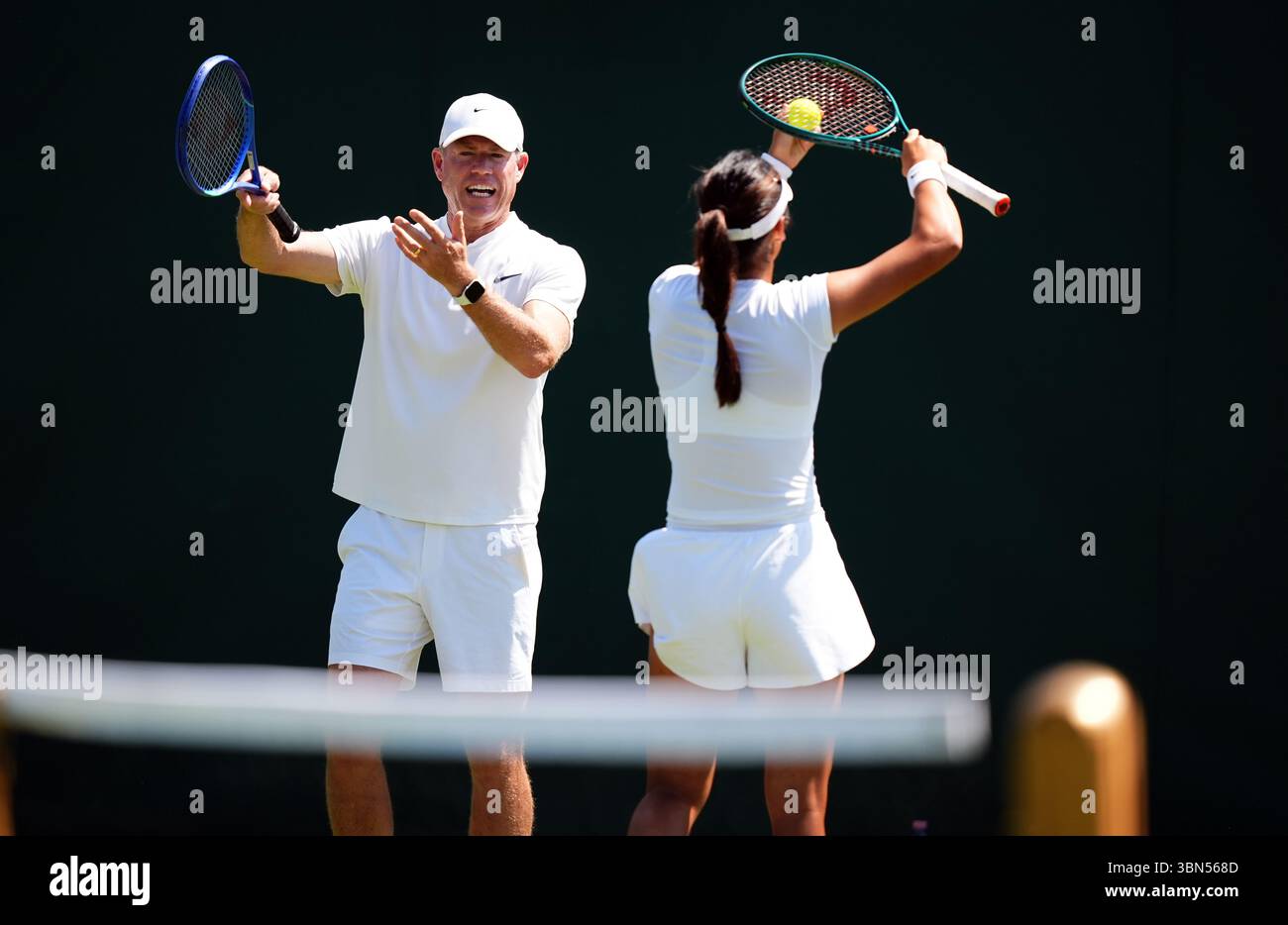 Emma Raducanu with coach Mark Petchey during a practice session on day ...