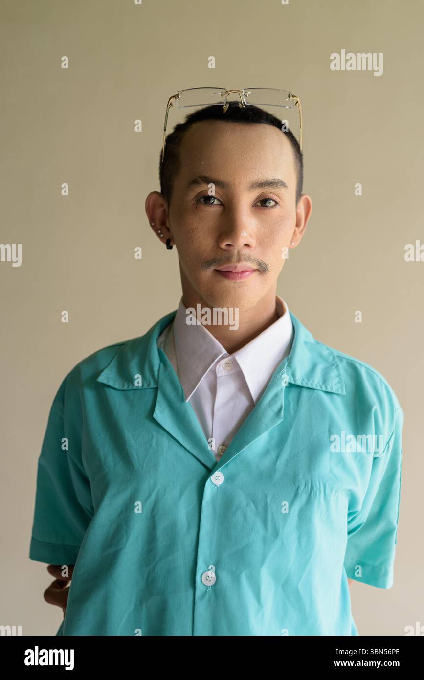 Portrait of non binary gay man doctor Stock Photo - Alamy