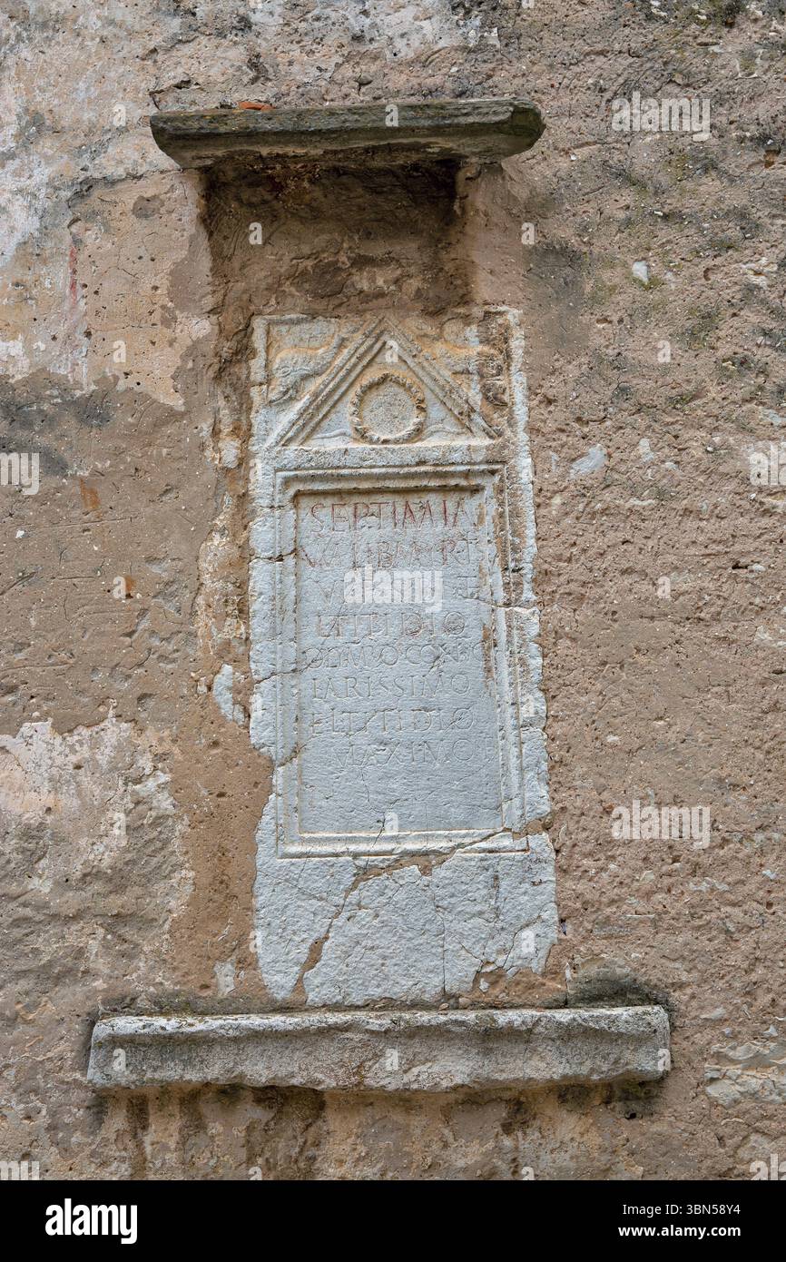 Ancient Roman stone memorial plate with carved Latin inscription ...