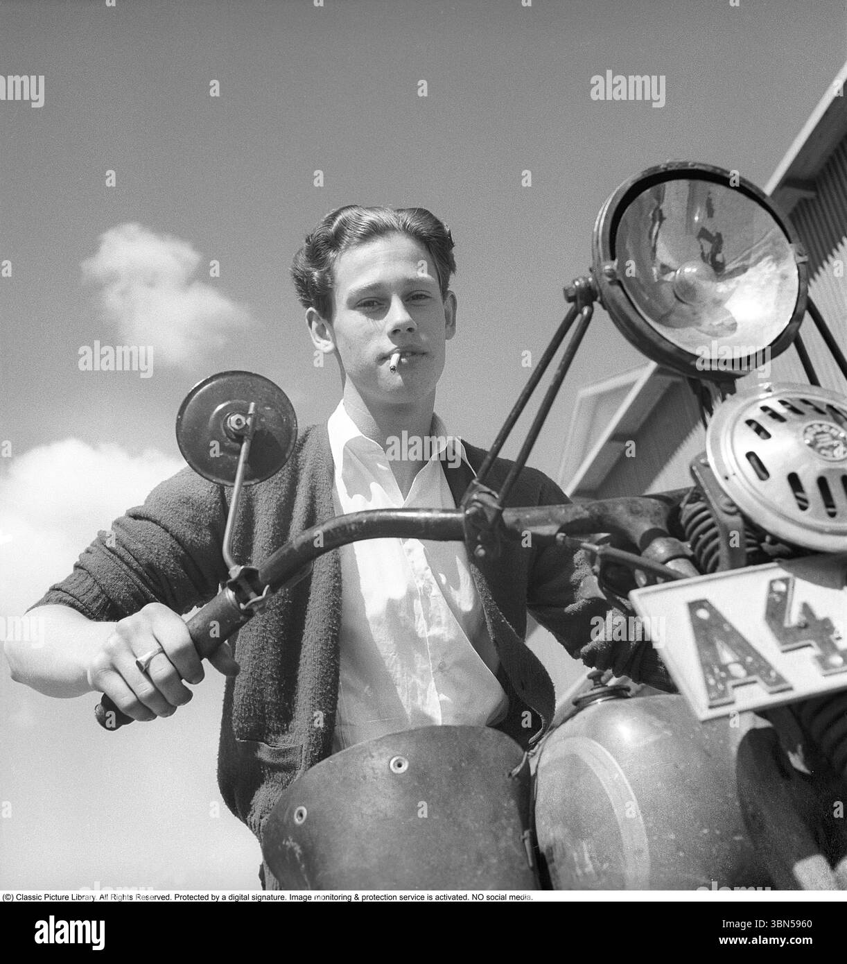 The Motorcycle Courier, 1947. A young lad on his motorcycle, an American Harley Davidson 1200 cc ...