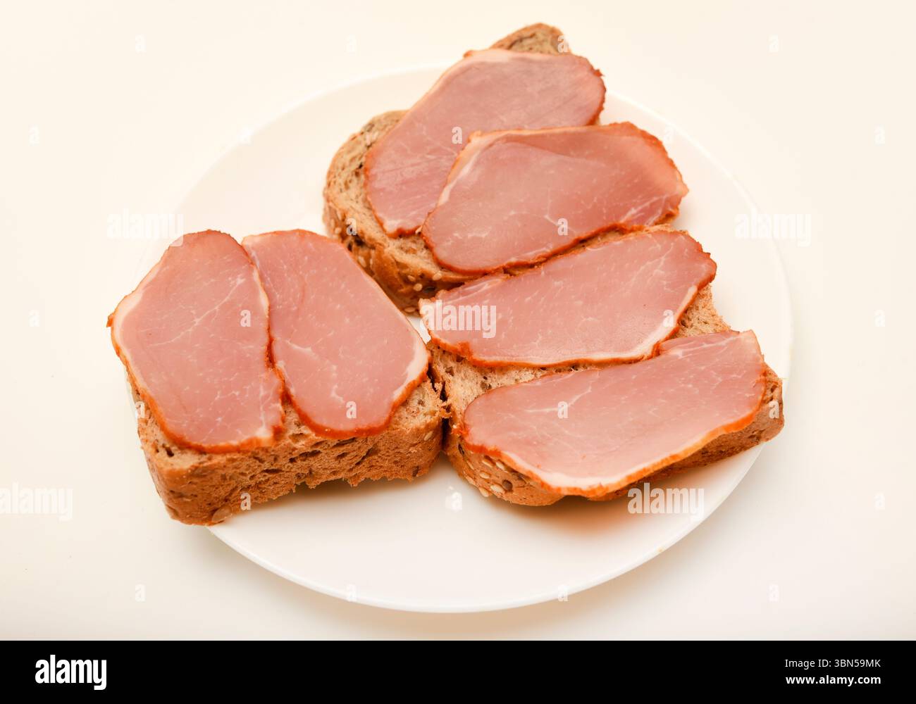 Ham sandwiches. Ham cut into thin slices Stock Photo - Alamy