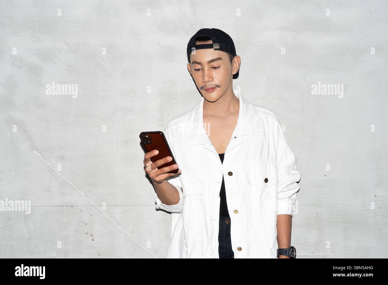 Portrait of non binary young handsome gay man Stock Photo - Alamy