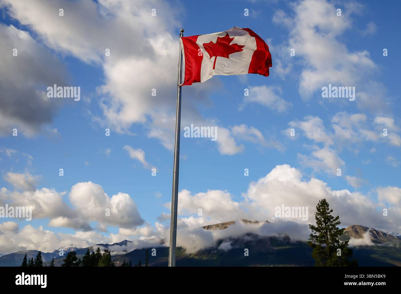 Canada flag flying rocky hi-res stock photography and images - Alamy