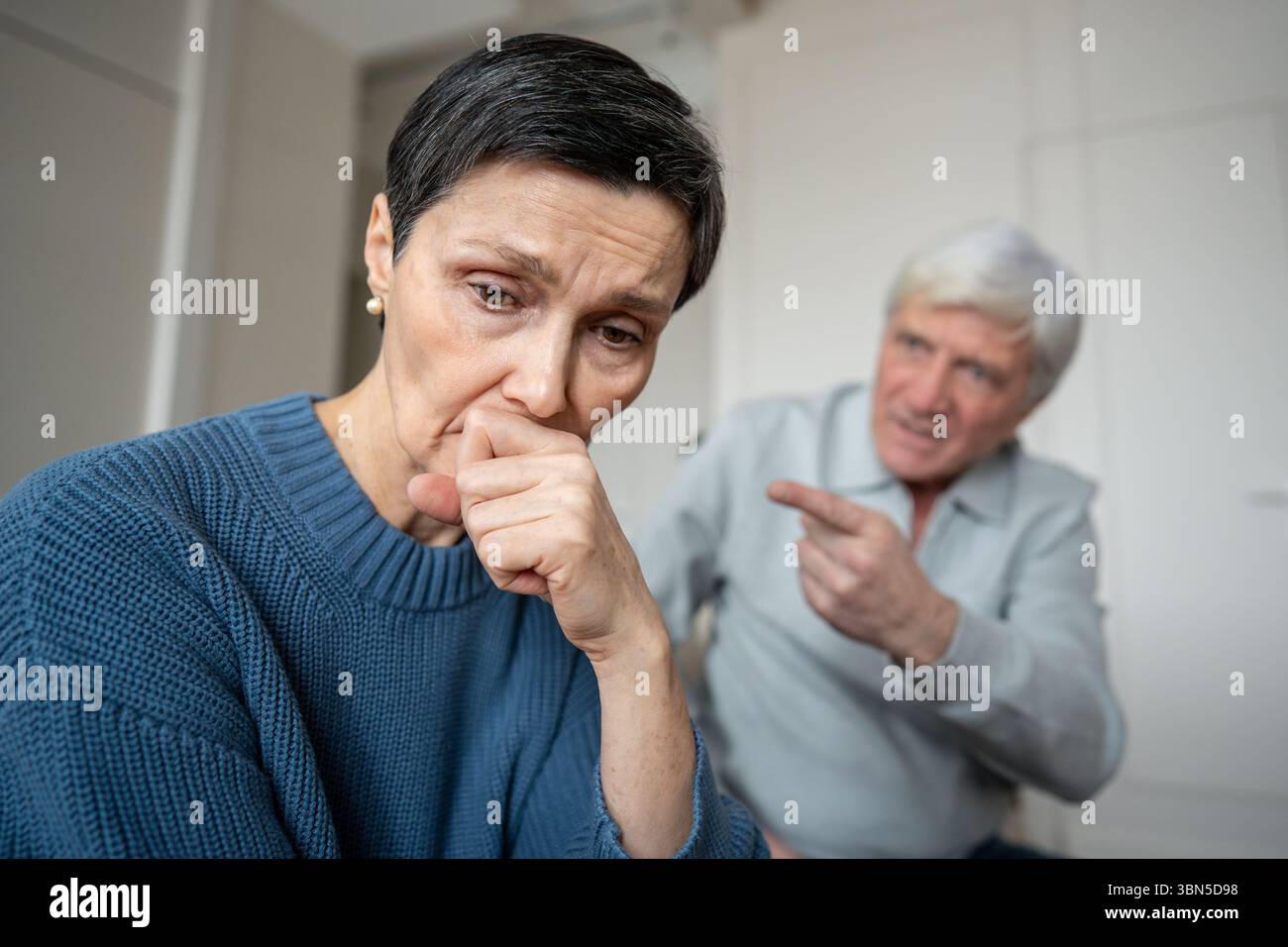 Shocked sad frightened mature woman feeling wronged by hysterical ...