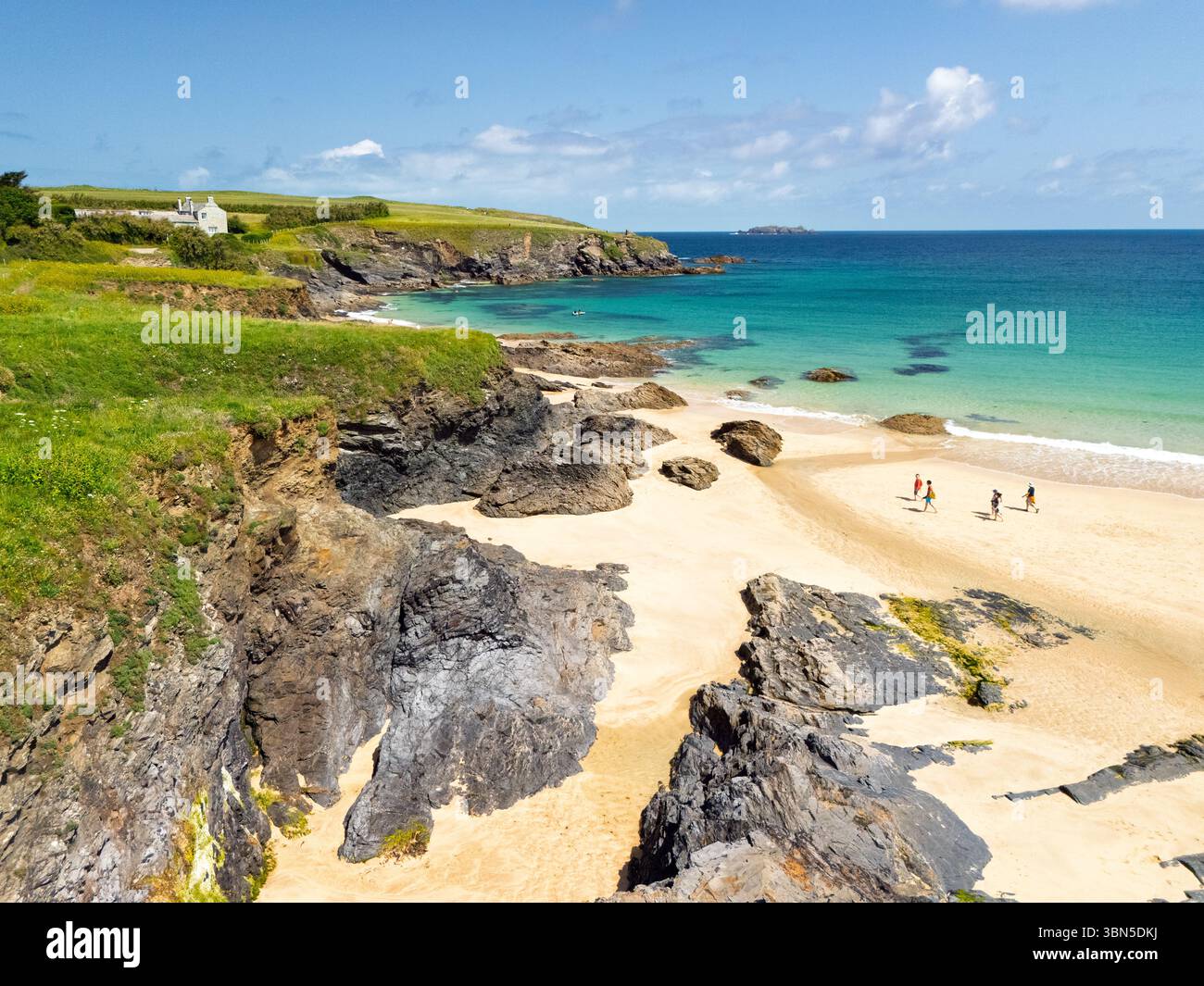 An aerial view captures the serene beauty of a beach with people ...