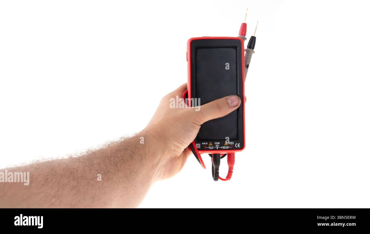 Hand holding a multimeter on a white background Stock Photo - Alamy