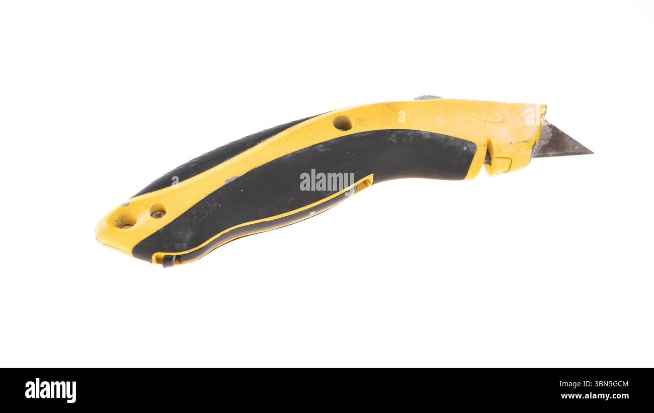 Black and yellow utility knife for cutting Stock Photo - Alamy
