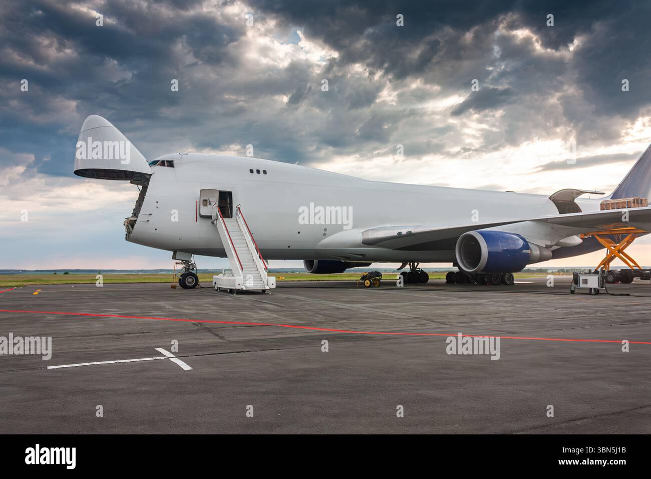 Loading cargo into wide body freight aircraft with an open nose hatch ...