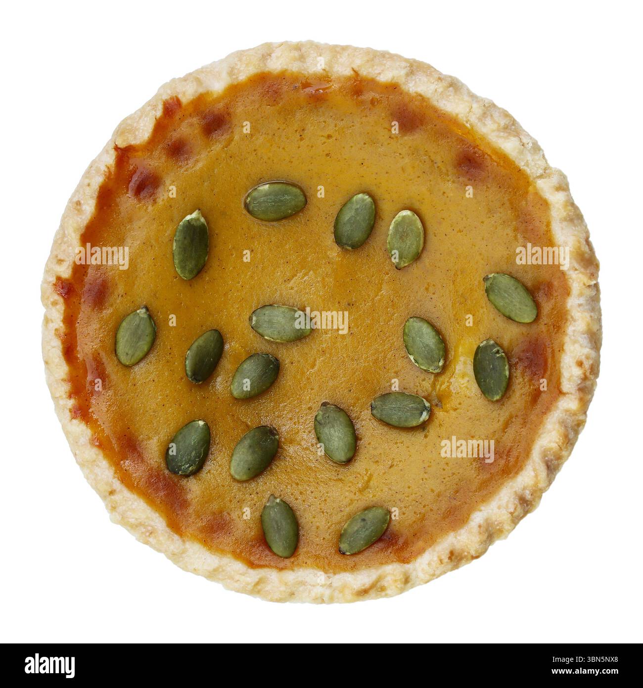 circle pumpkin pie decorated with green pumpkin seeds isolated on white ...