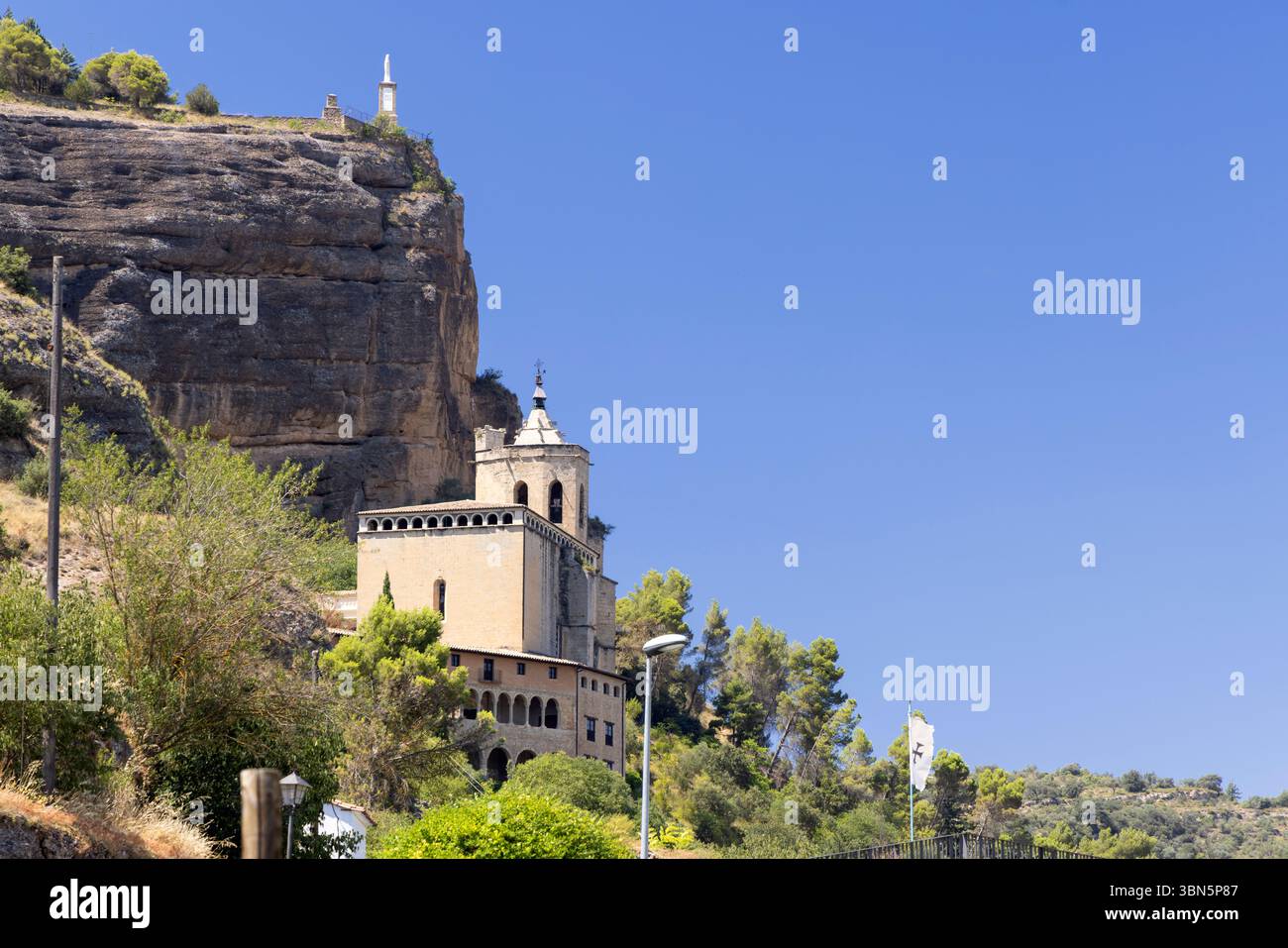 The Basilica de la Pena and a cliffside statue are overlooking the town ...