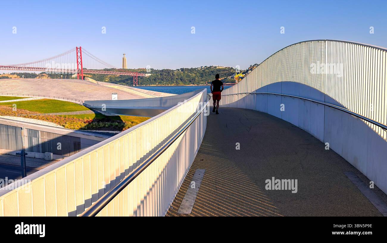 Modern curved pedestrian walkway at MAAT Museum in Belém, Lisbon, with ...