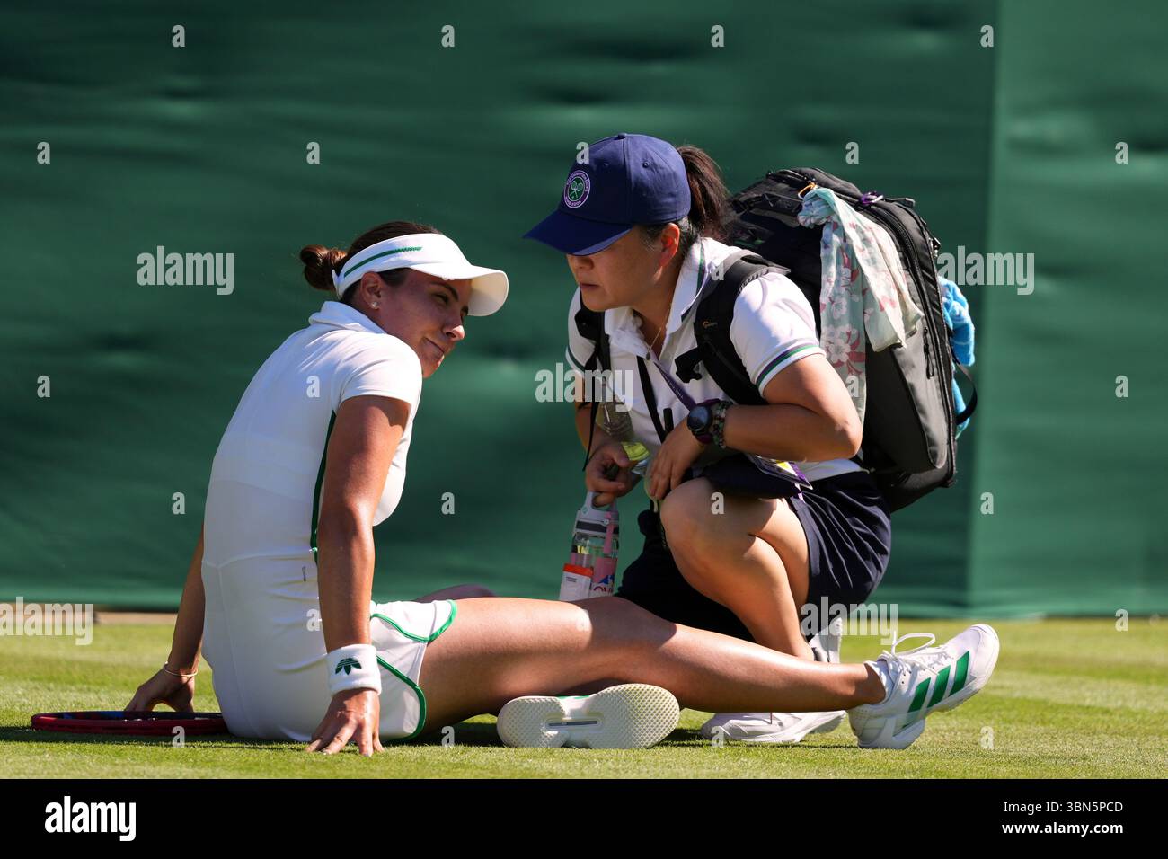 Elena-Gabriela Ruse of Romania get medical assistance during her first ...