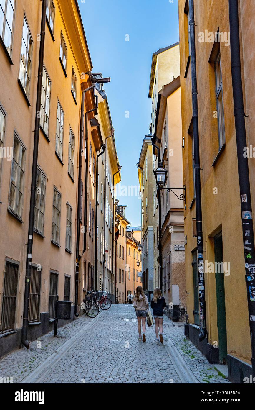 Narrow cobblestone alley with historic buildings in Stockholm's Gamla ...