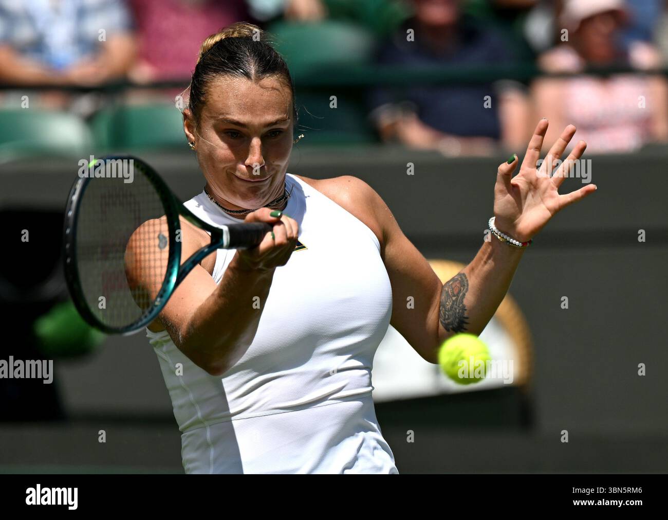 London, Britain. 30th June, 2025. Aryna Sabalenka hits a return during ...