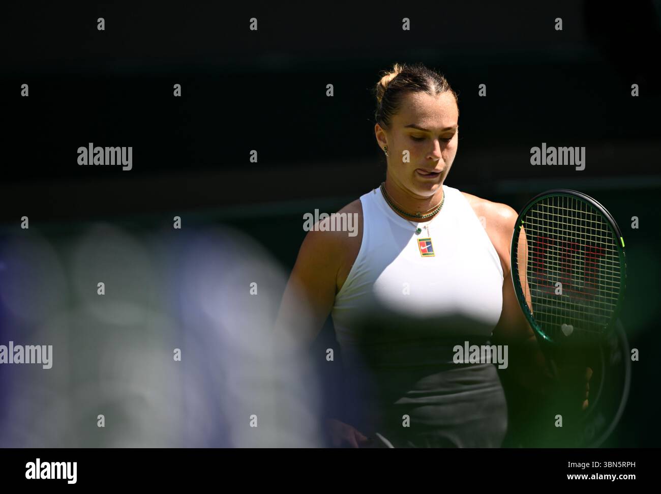 London, Britain. 30th June, 2025. Aryna Sabalenka reacts during the ...