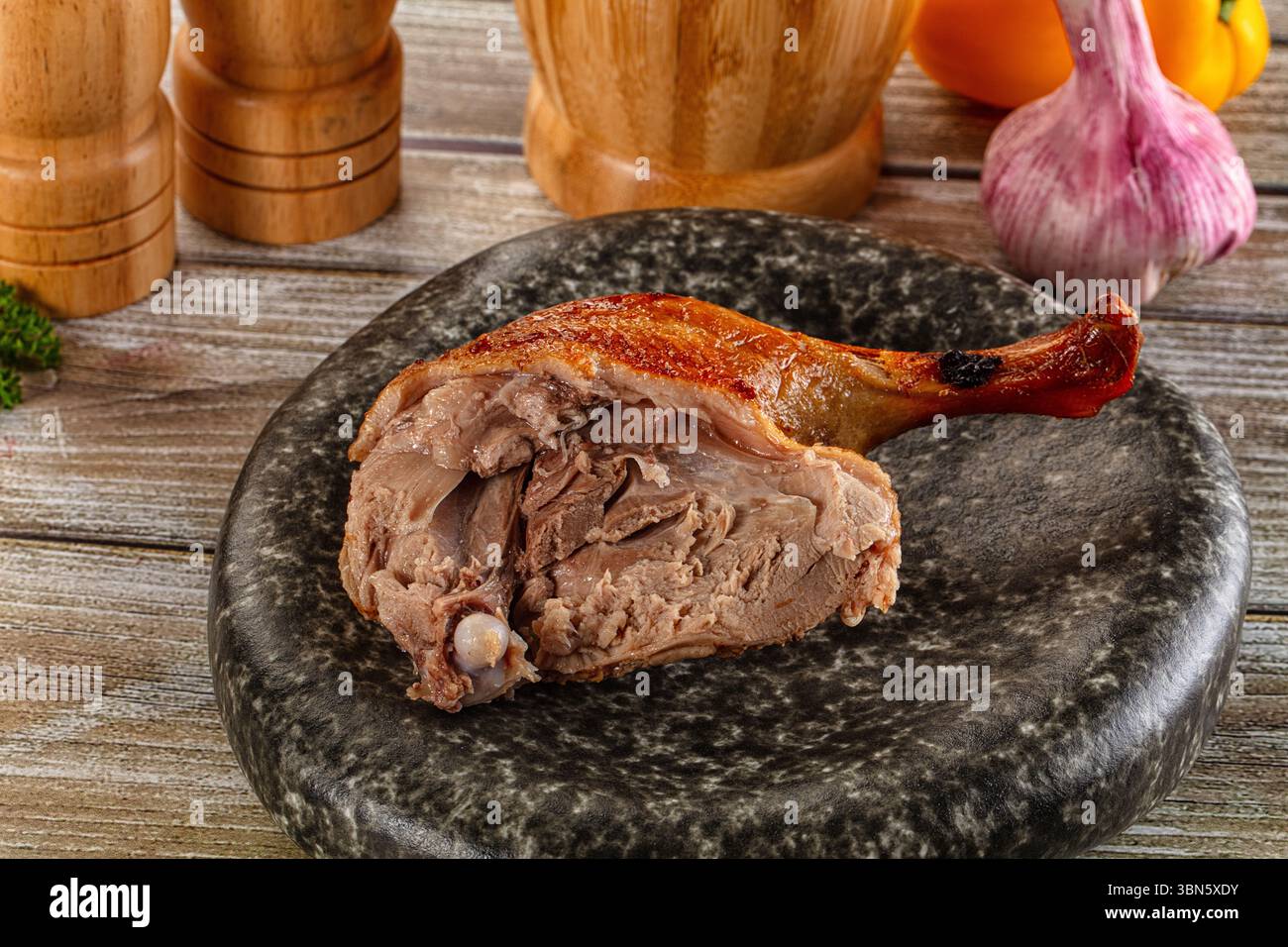 Gourmet roasted tasty duck leg with skin Stock Photo - Alamy