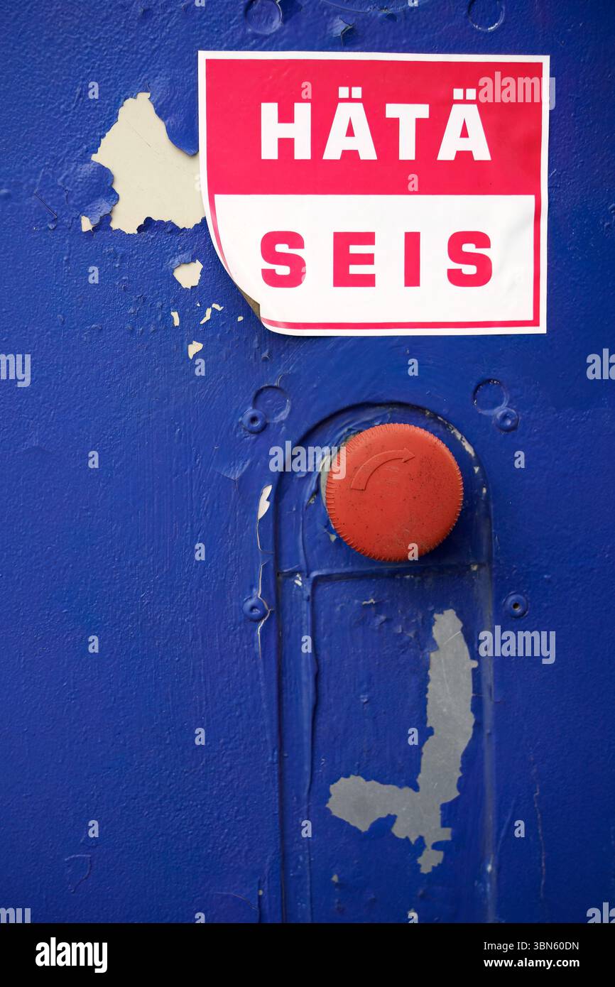 Red push button with a Finnish hätä seis (emergency stop) sticker Stock ...