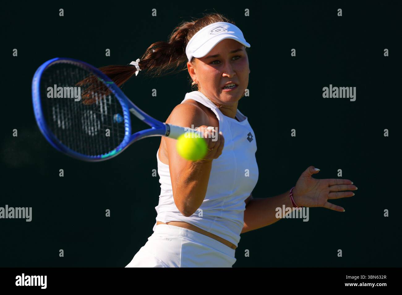 Kamilla Rakhimova of Russia returns the ball during her first round ...