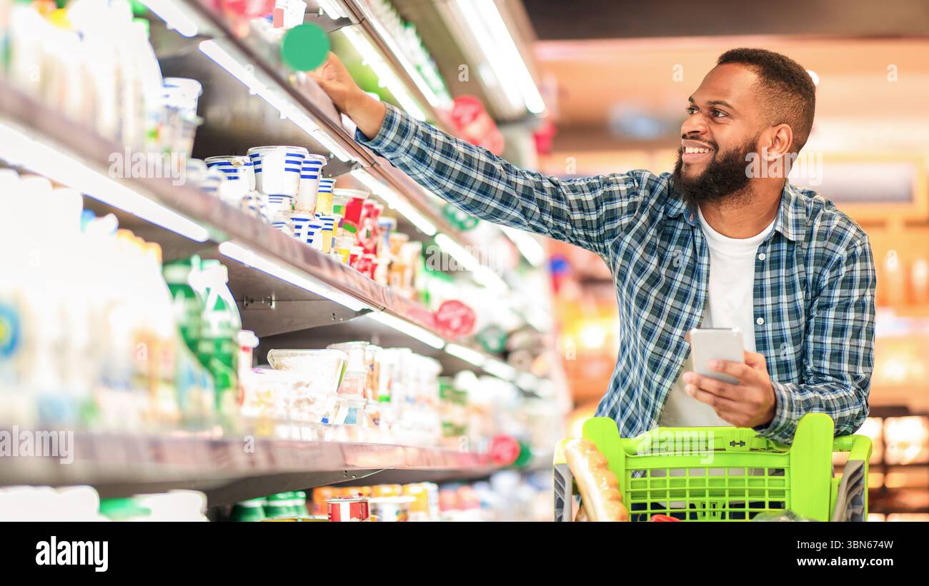 Black Male Shopping Groceries In Supermarket Taking Product From Shelf ...