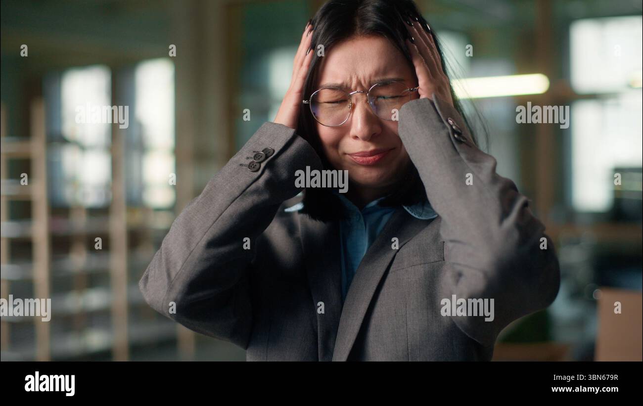 Stress work problem annoyed Asian Chinese Korean business woman holding ...