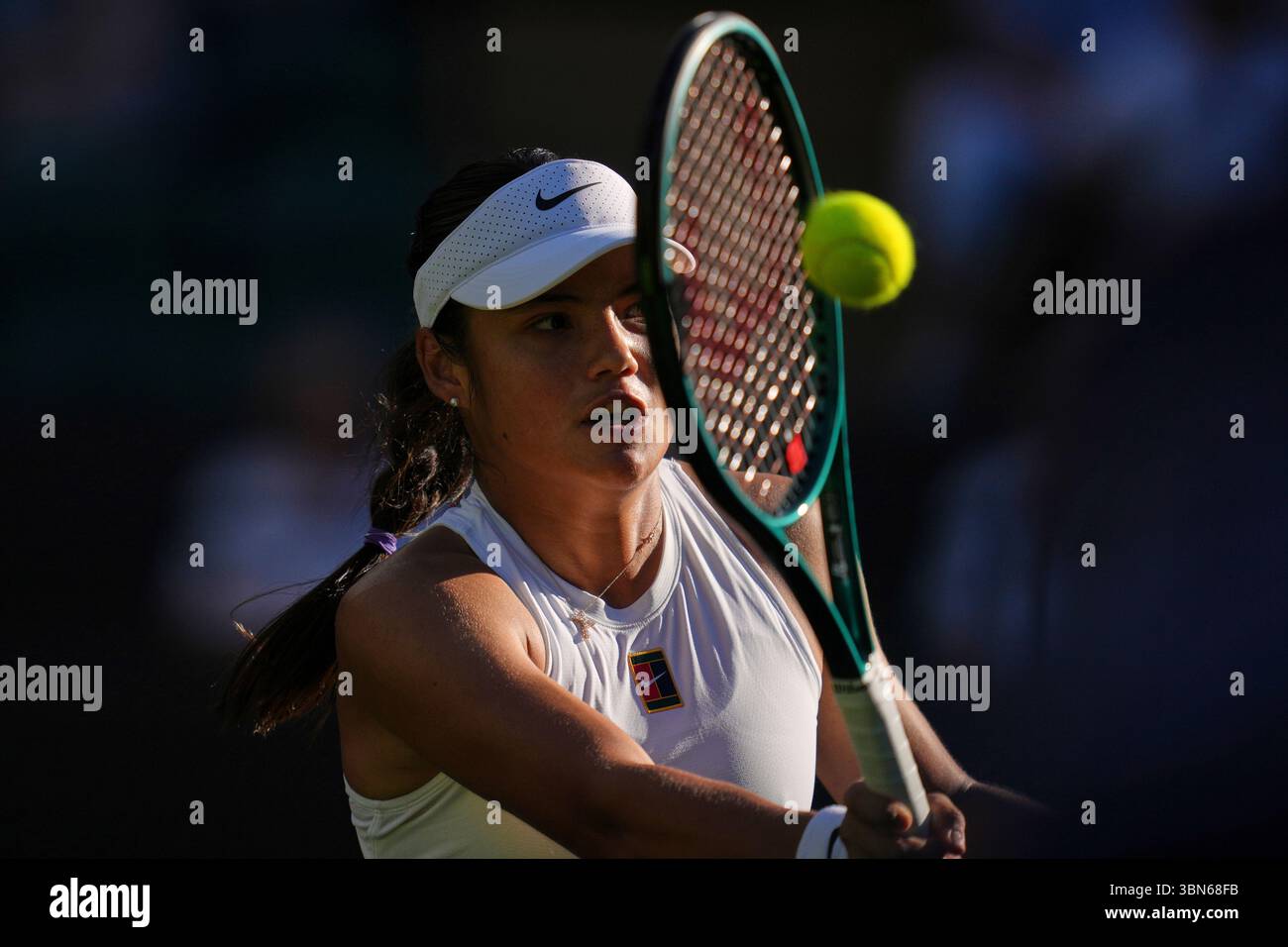 Emma Raducanu of Britain returns the ball during her first round women ...