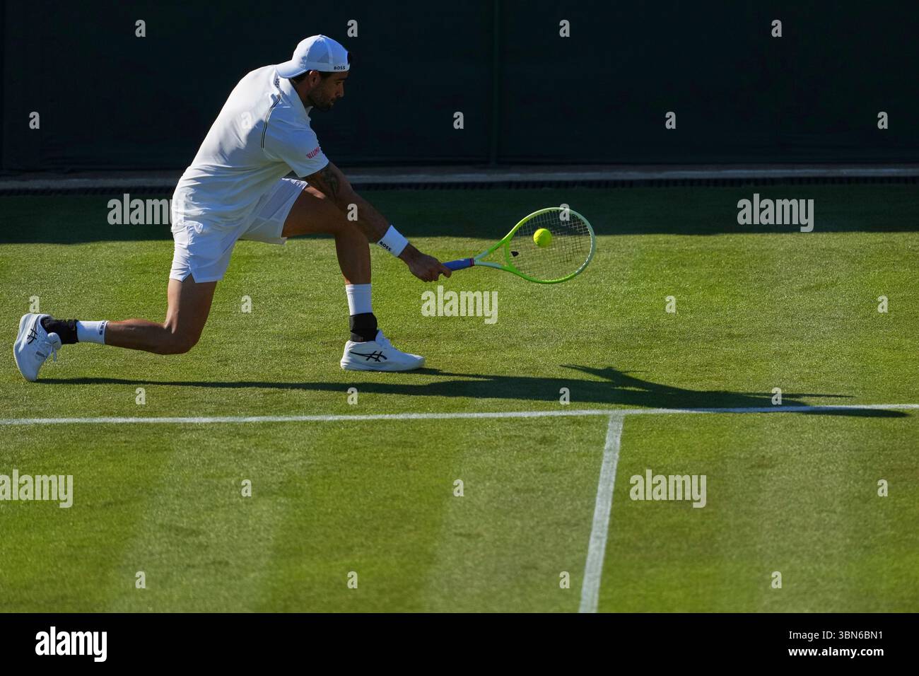 Matteo Berrettini of Italy returns to Kamil Majchrzak of Poland in their first round men's ...