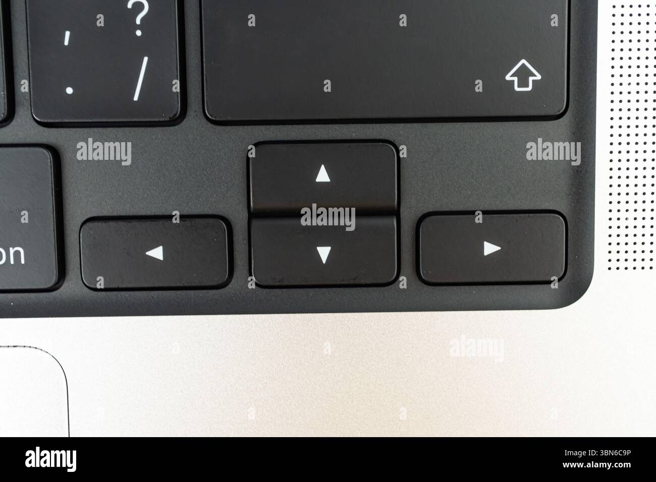 The image showcases a close-up of laptop directional keys up, down ...