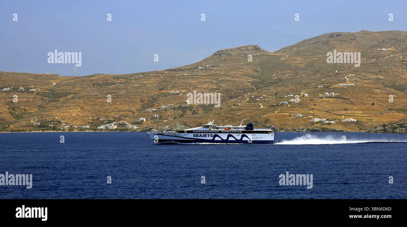 Fast SeaJets ferry boat travels past Tinos island, The Cyclades island ...