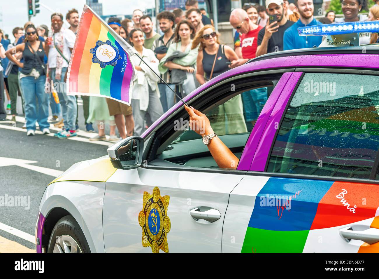 Rainbow-colored Garda car leads the Dublin Pride Parade, symbolizing ...