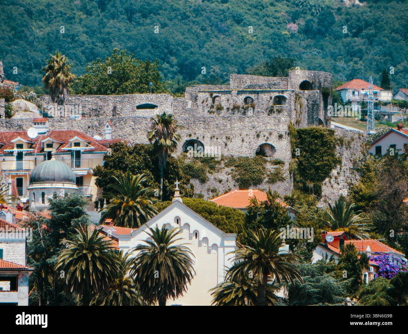 Discover Herceg Novi, where historic fortresses rise above lush greenery and charming ...