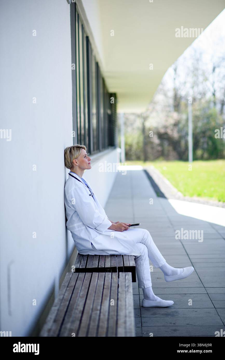 Portrait exhausted female doctor taking hi-res stock photography and ...