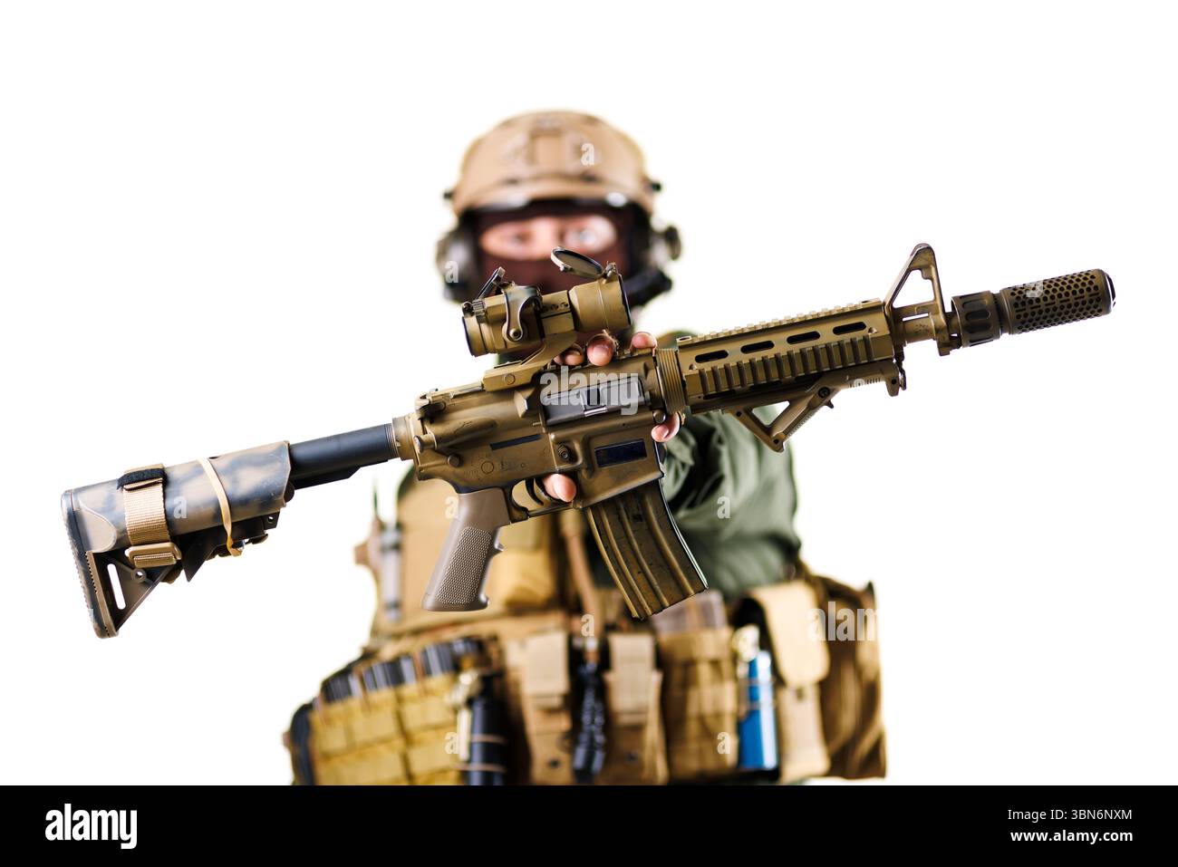 Focused image showing an armed individual wearing tactical gear and ...
