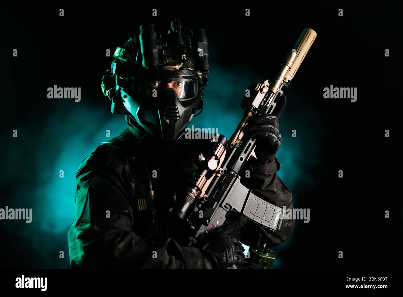 A soldier wearing advanced tactical gear and holding a rifle, standing ...