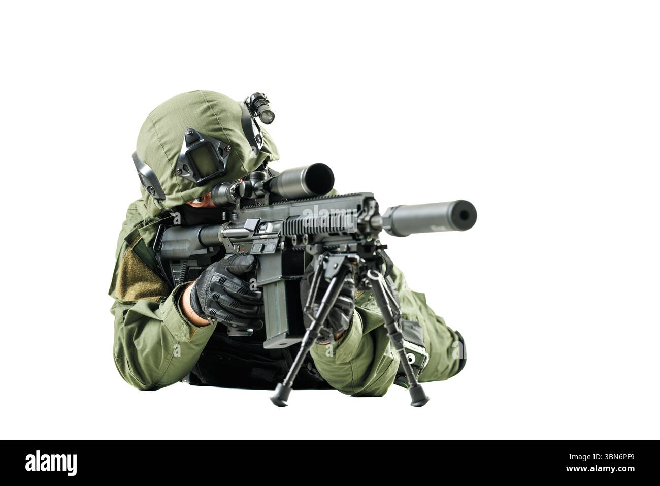 Soldier wearing tactical gear operating precision rifle in stationary ...