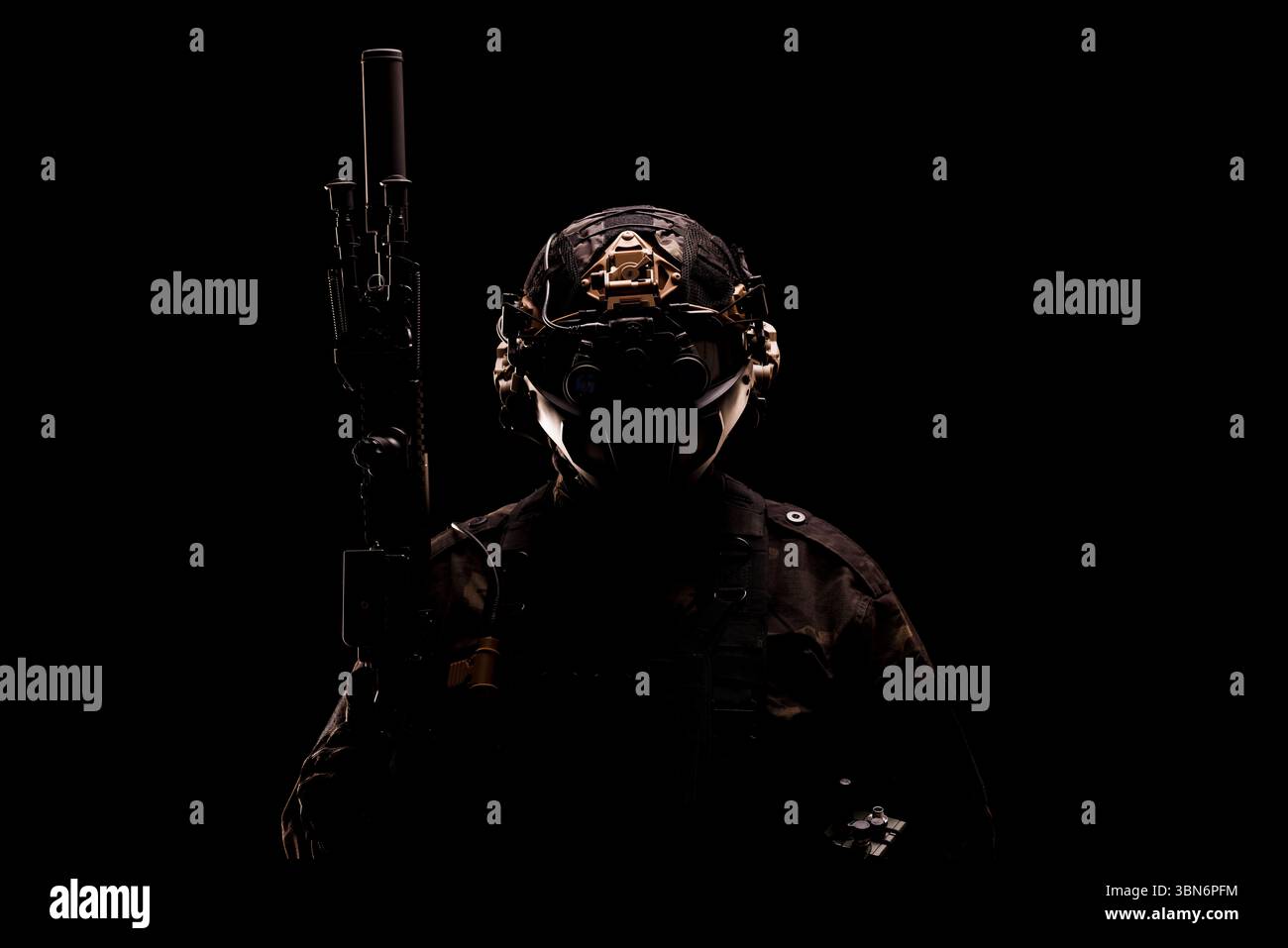A silhouetted figure of a tactical soldier in specialized gear ...