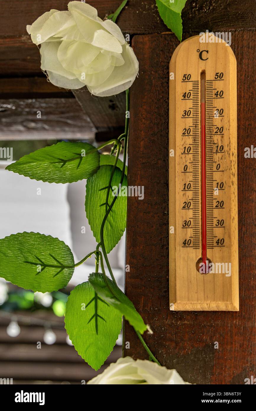Wooden mercury thermometer showing very high temperature in summer on ...